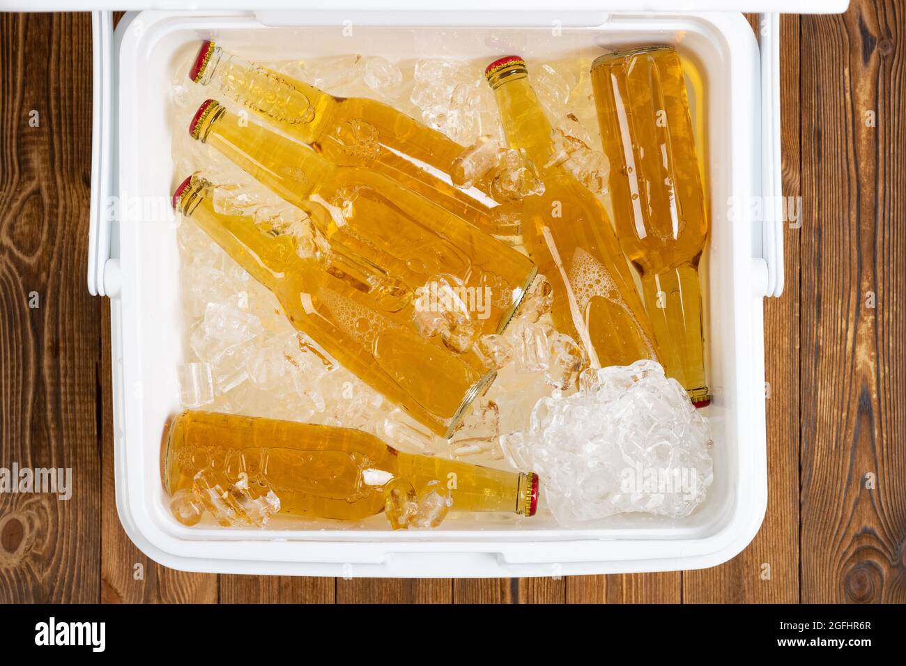 top view bottles of beer in a case with ice Stock Photo - Alamy