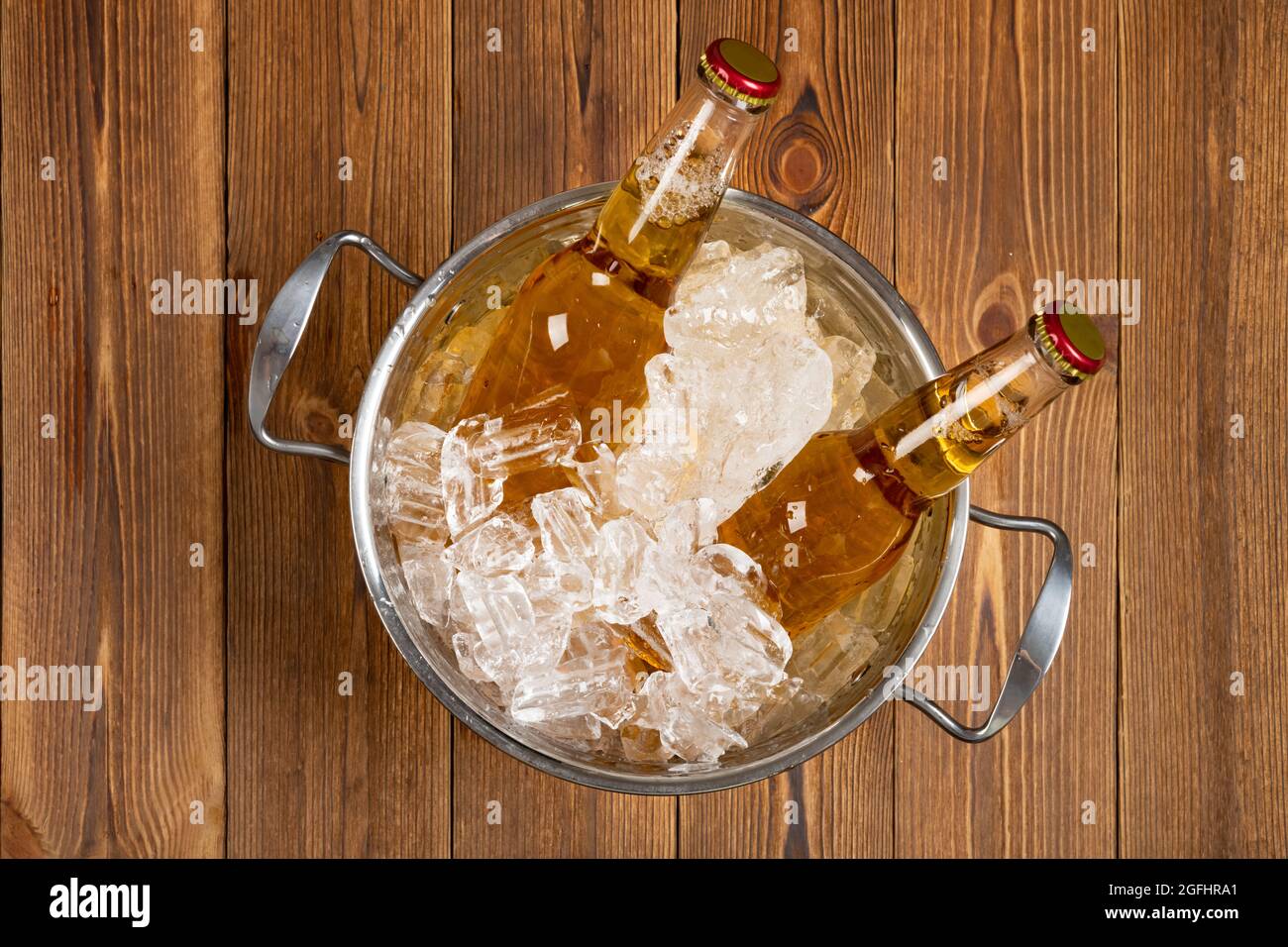 top view bottles of beer in a still bucket with ice Stock Photo - Alamy