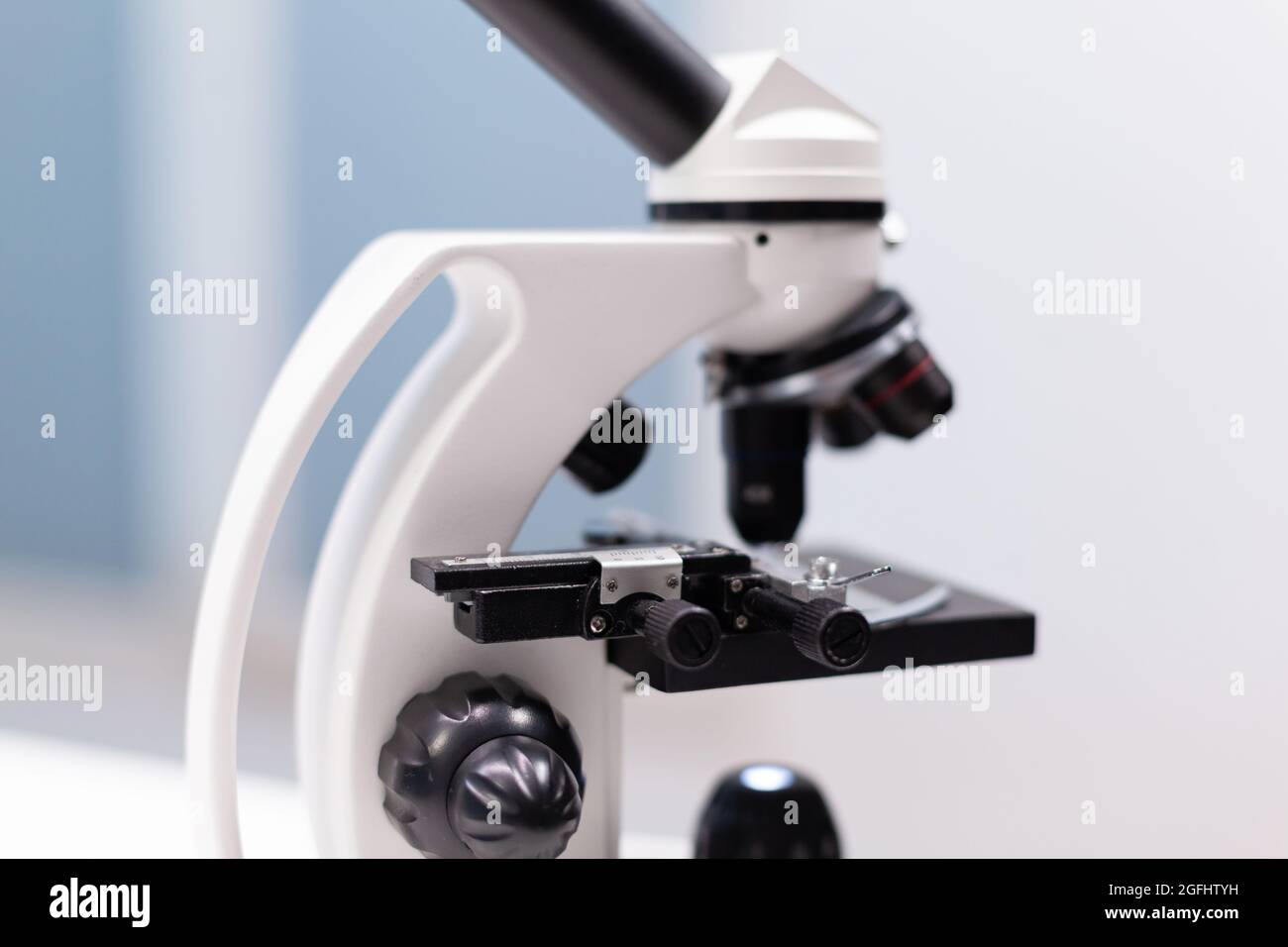 Medical microscope standing on table ready microbiology experiment in ...