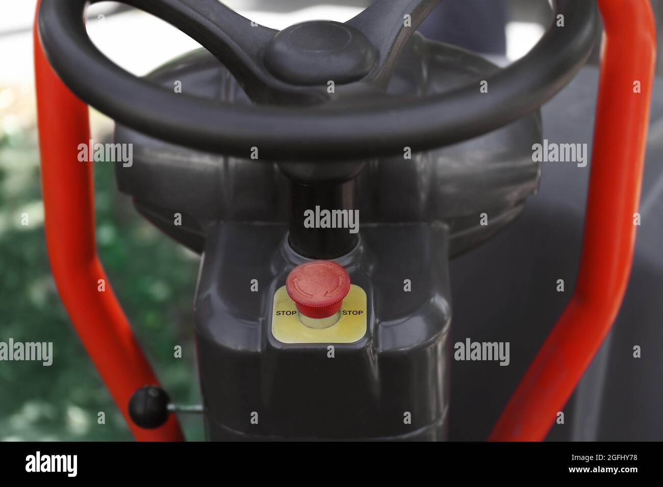 Stop button under steering wheel of road roller, closeup Stock Photo ...