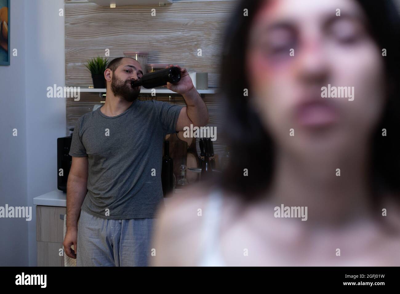 Woman having domestic violence bruises from partner while alcoholic ...