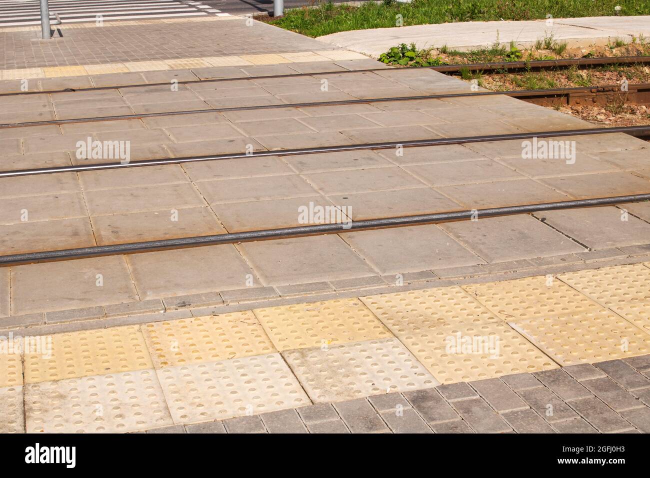 Pedestrian crossing on tram tracks close up Stock Photo - Alamy