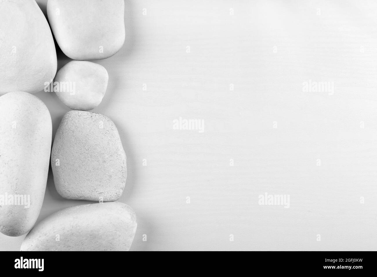 Spa stones on white background Stock Photo - Alamy