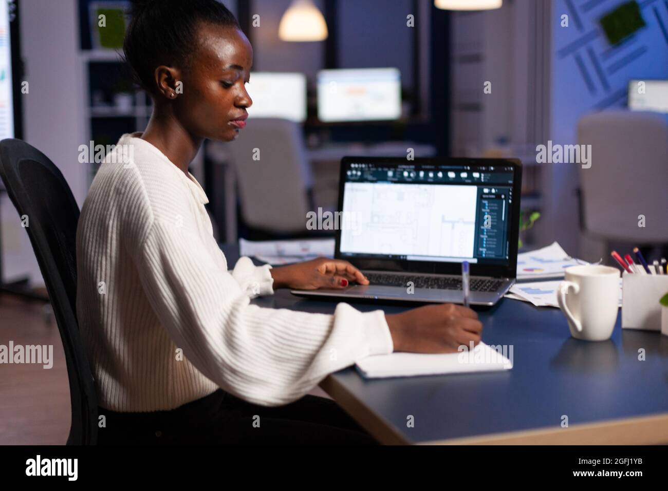 Focused african american arhitect engineer developing cad building ...