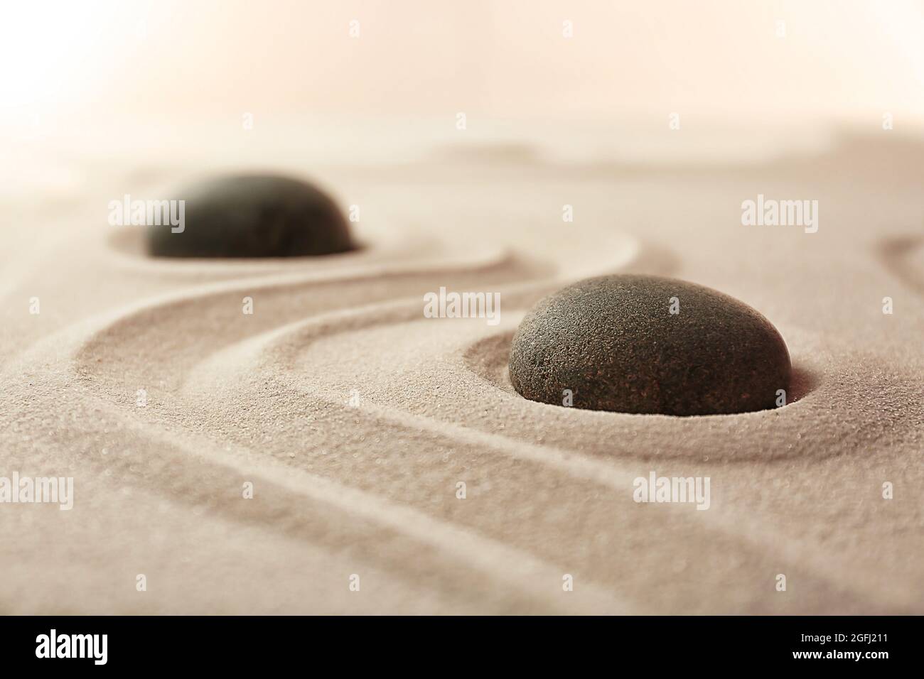 Japanese Zen garden. Pebbles on a sand Stock Photo - Alamy