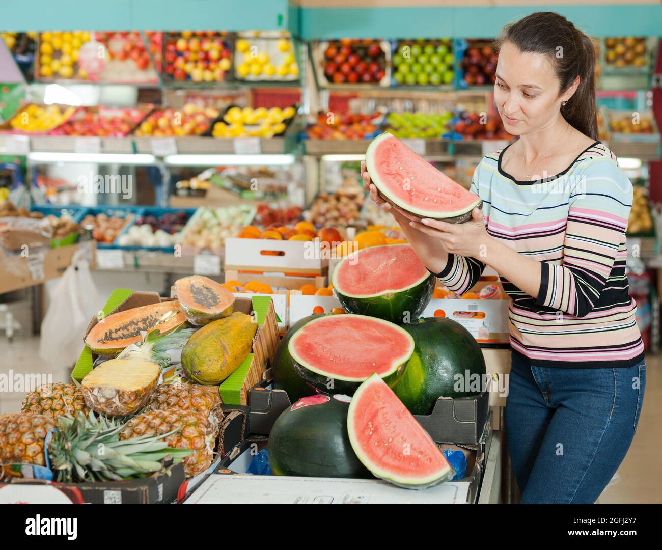 female choosing fruits at store Stock Photo - Alamy