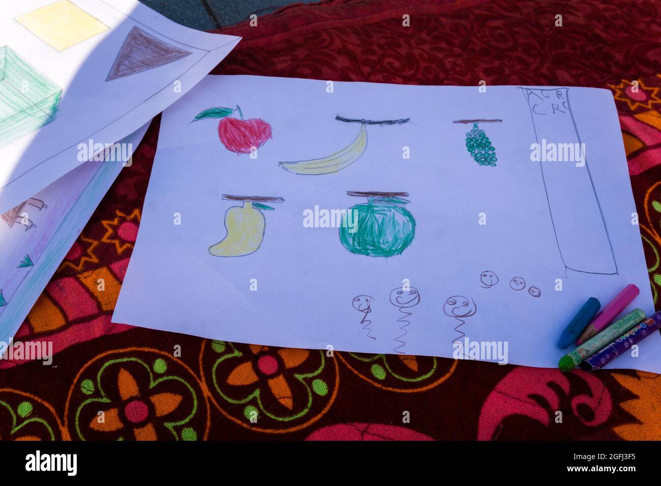 A close-up shot of a drawing made by kindergarten kids using different ...