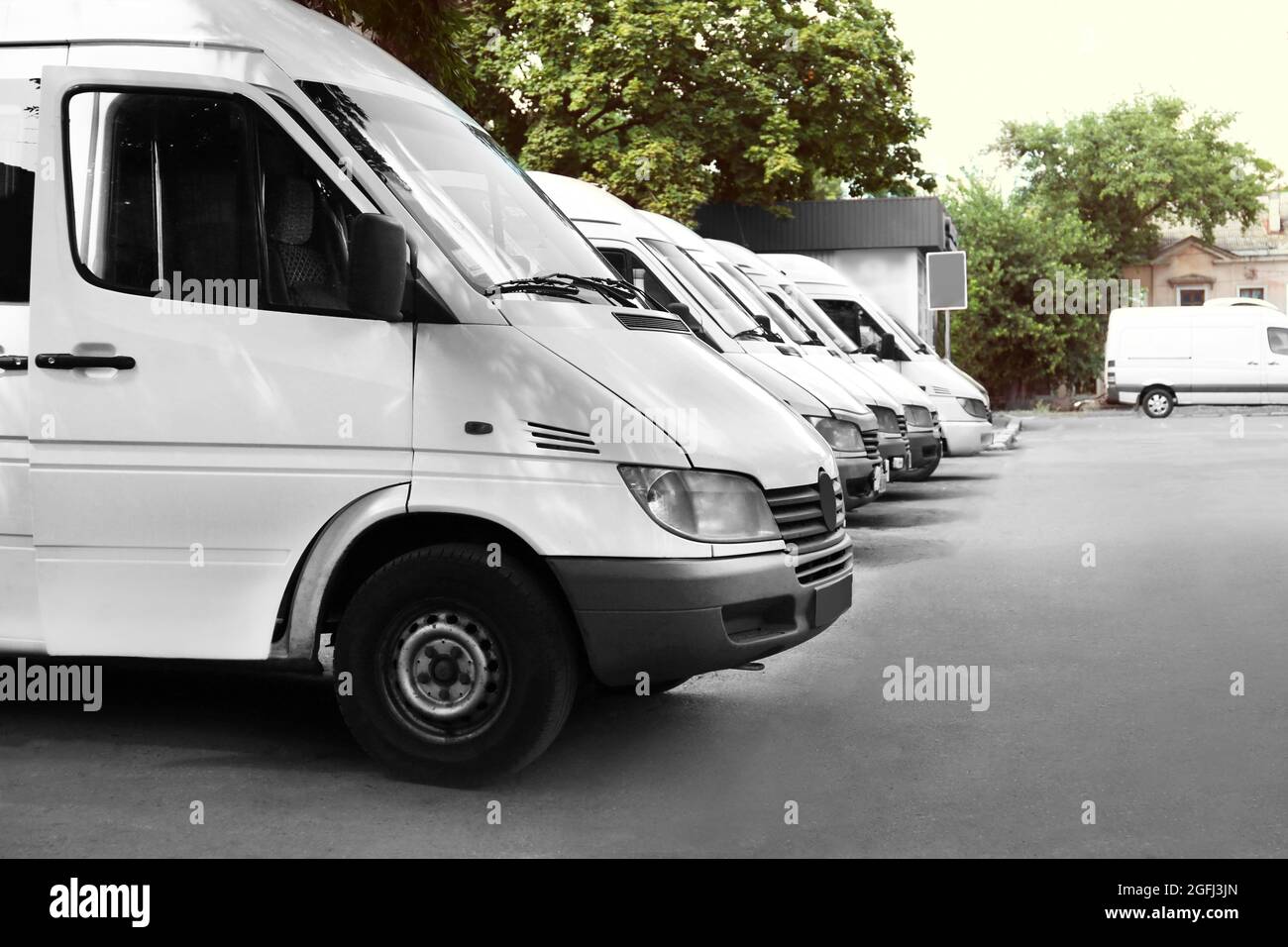 Parked buses in a row Stock Photo - Alamy