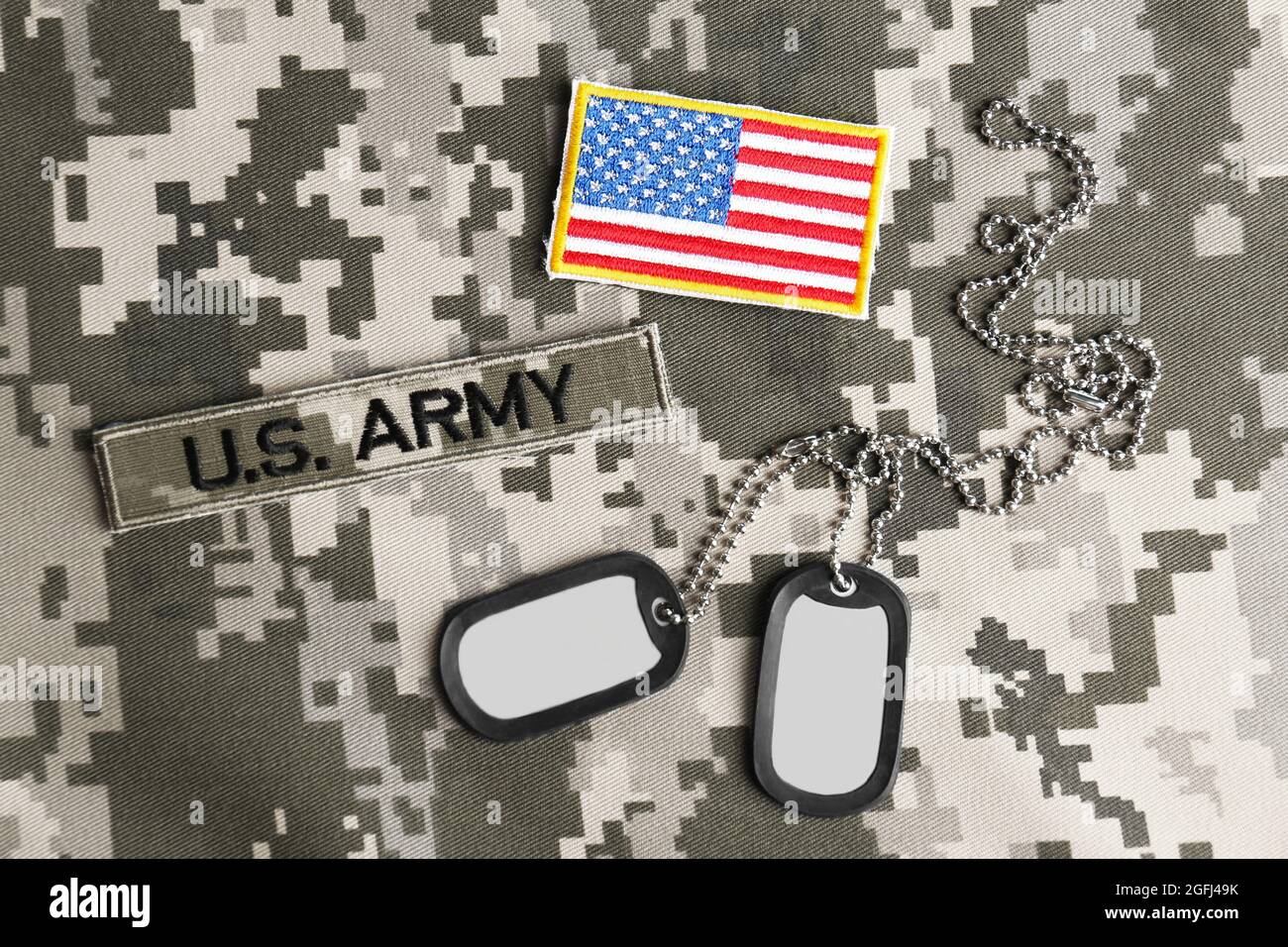 Army tokens and patches on military uniform background Stock Photo - Alamy