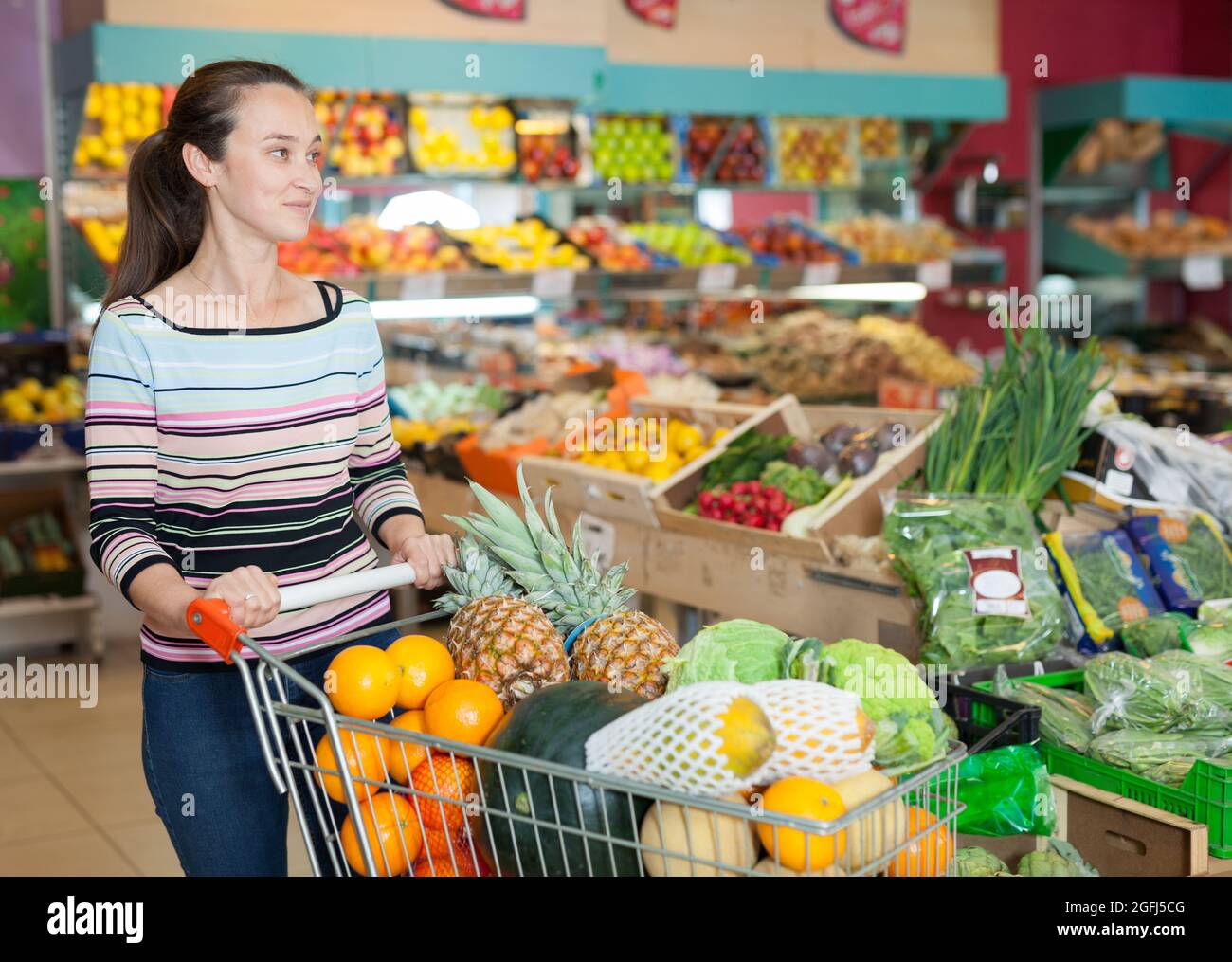 Female choosing fresh fruits and vegetables Stock Photo - Alamy