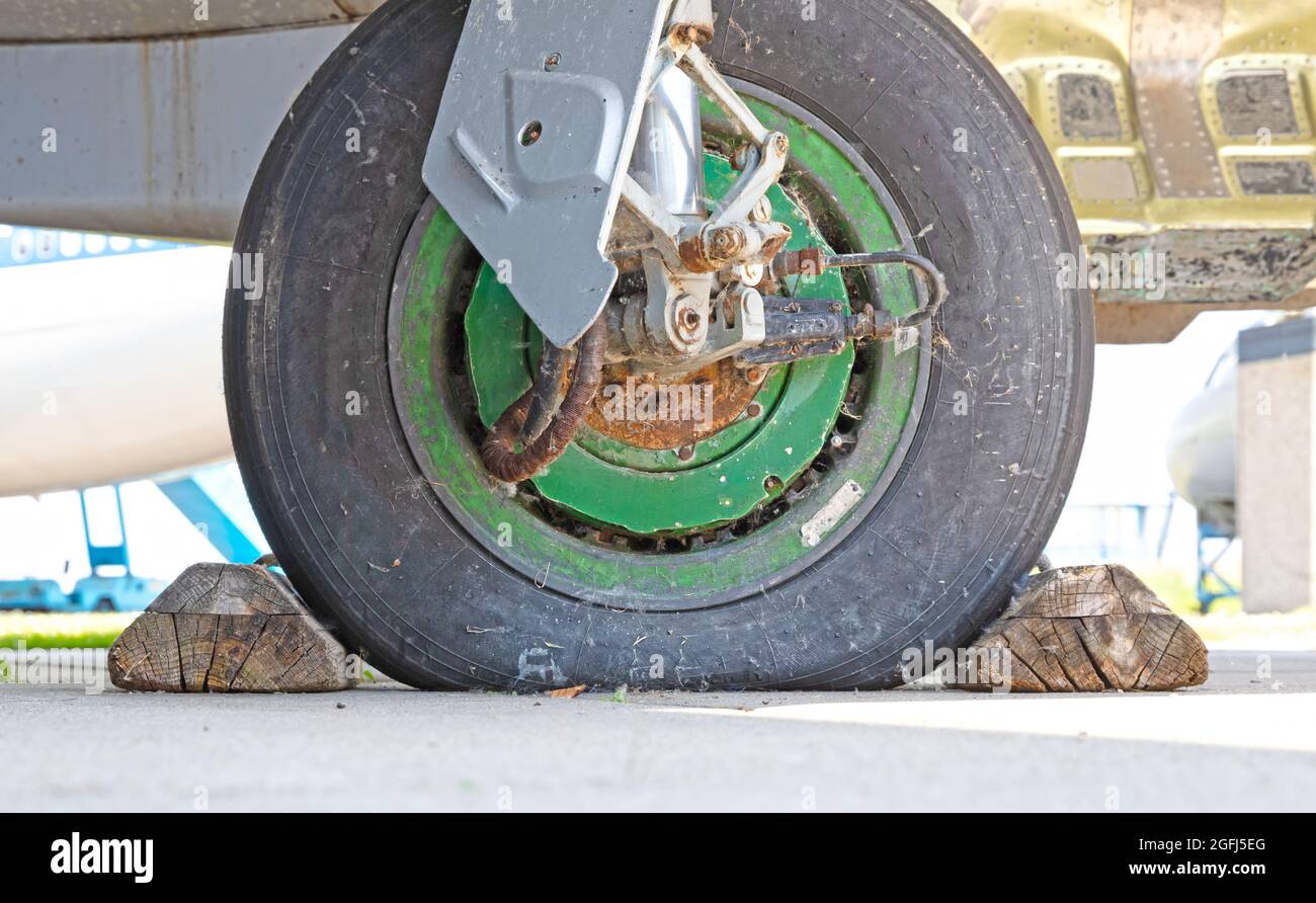 Old black flat wheel of an fighter jet, selective focus Stock Photo - Alamy