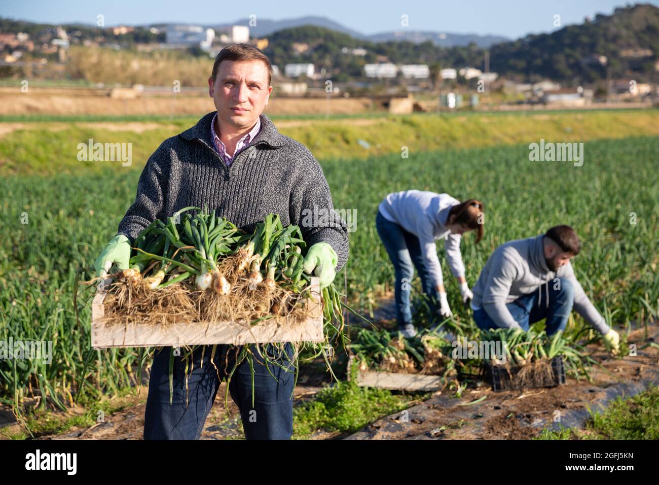 Team farmers man workers holding hi-res stock photography and images ...