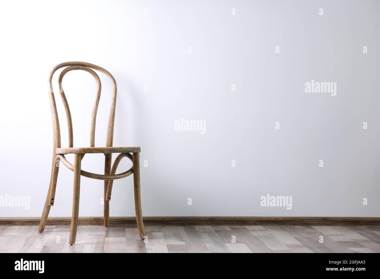 Simple interior with stool on white wall background Stock Photo - Alamy