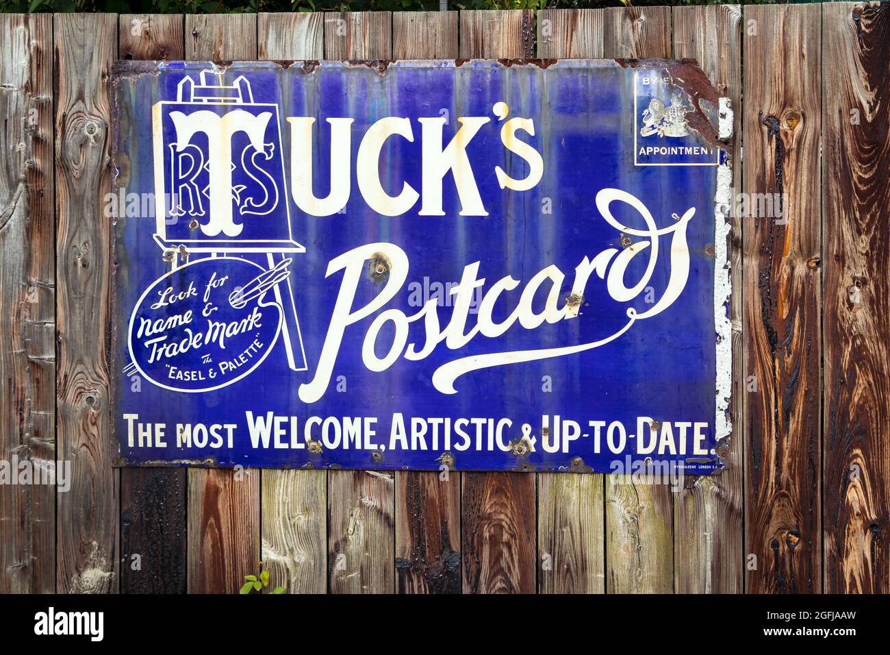 old vintage enamelled sign on wall for Tucks postcards at Beamish open ...