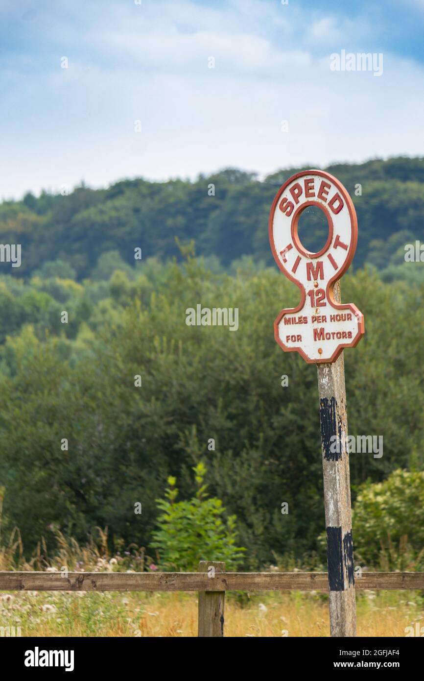speed limit 12mph old cast road sign Stock Photo - Alamy