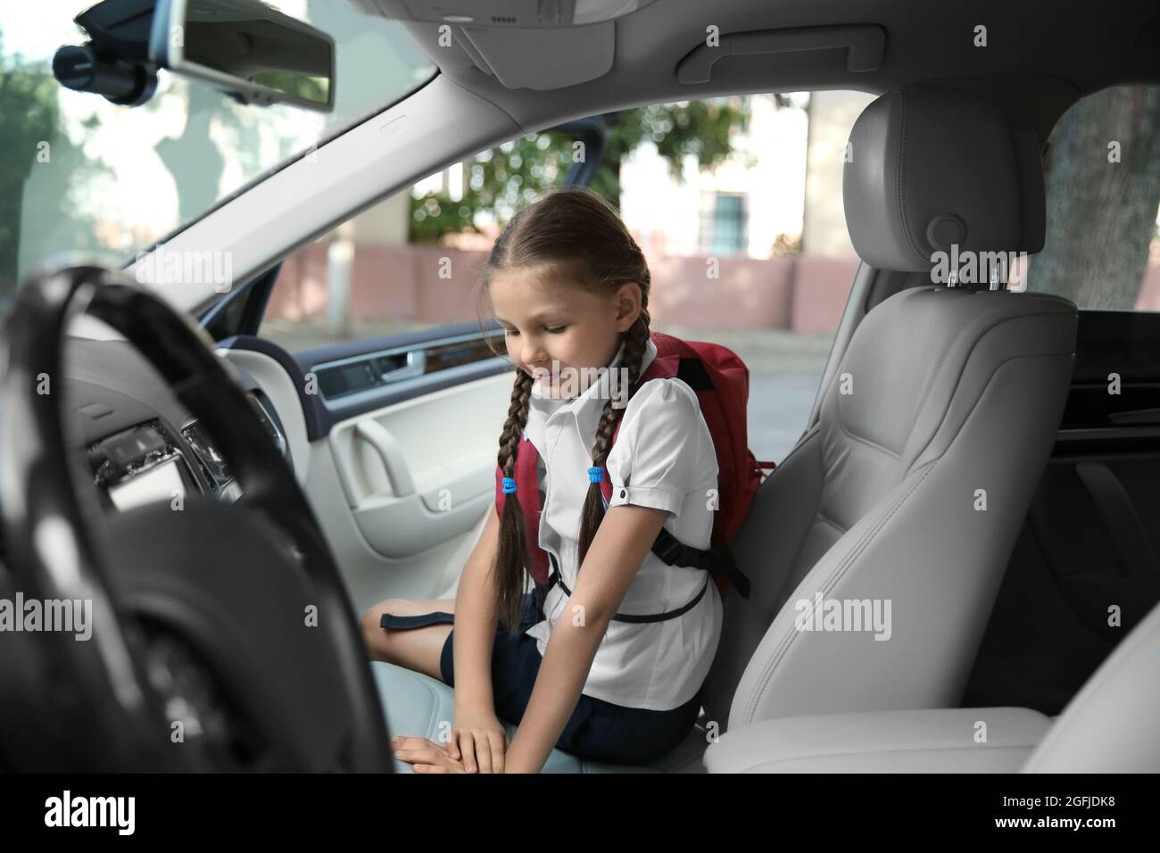 Child getting into car at school hi-res stock photography and images ...