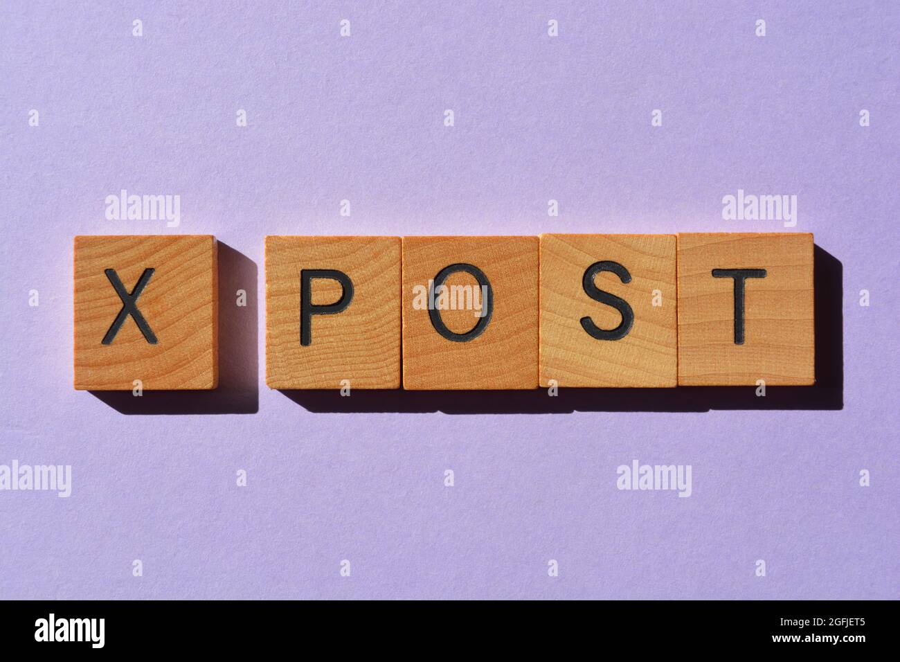 X Post, short for Cross Post, buzzword in wooden alphabet letters ...