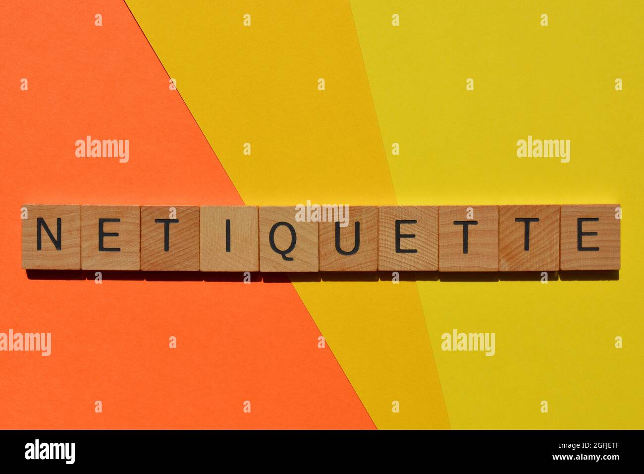 Netiquette, word in wooden alphabet letters isolated on colourful ...
