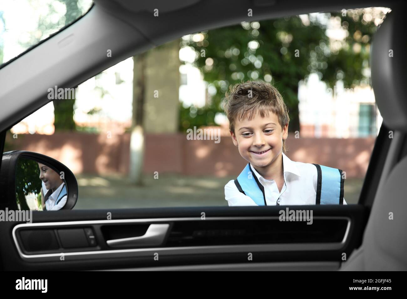 Child getting into car at school hi-res stock photography and images ...