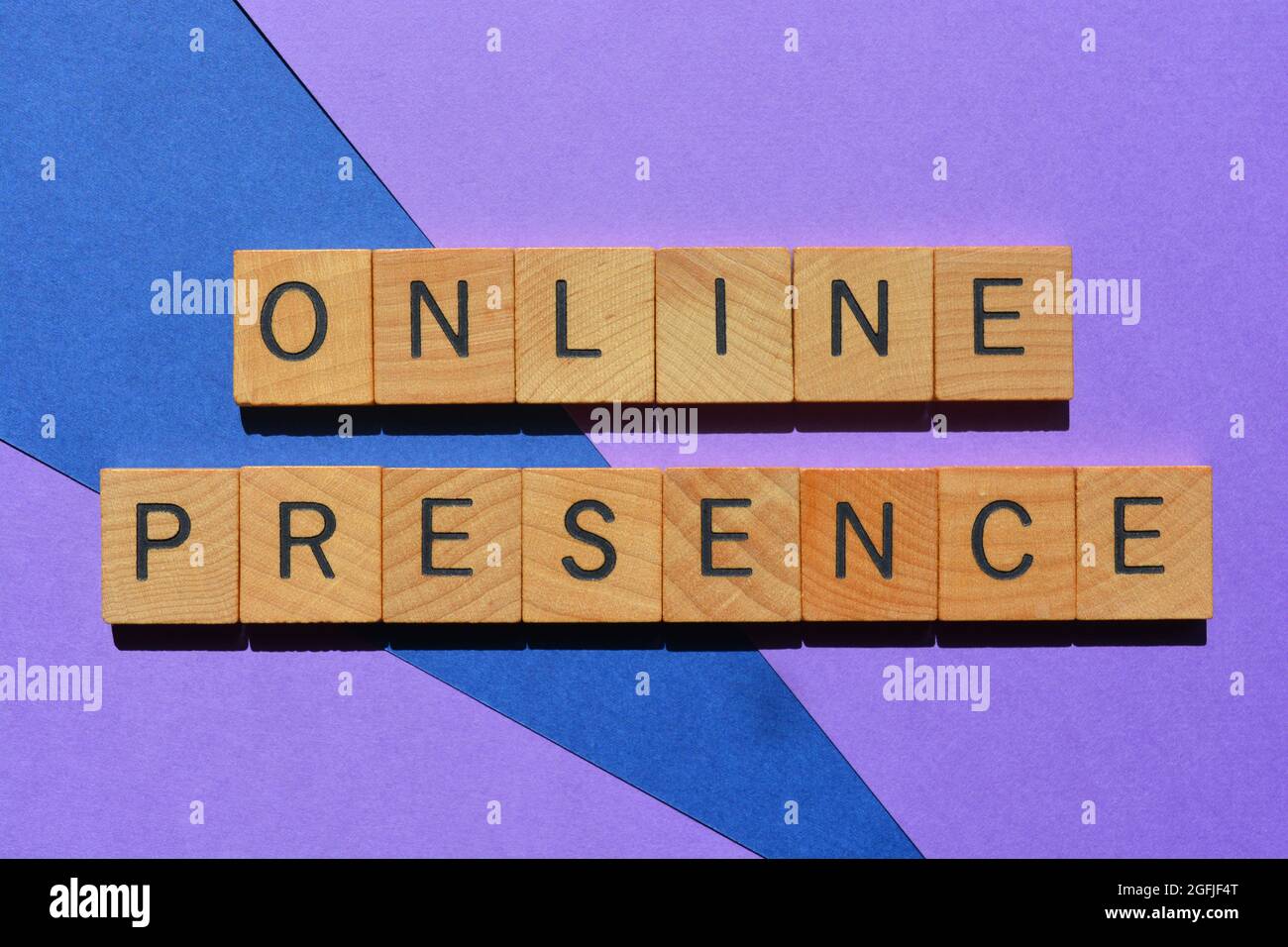Online Presence, words in wooden alphabet letters isolated on blue and ...