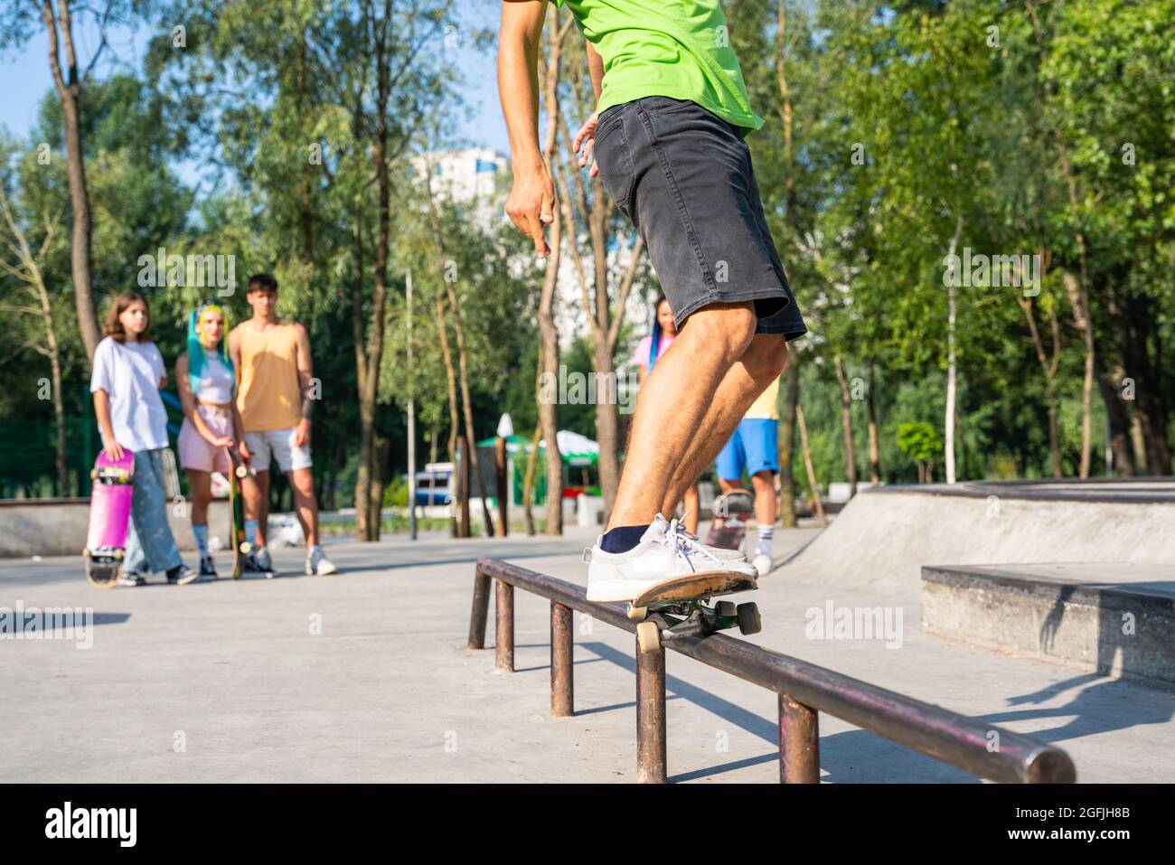 professional skateboarders having fun at the skate park Stock Photo - Alamy