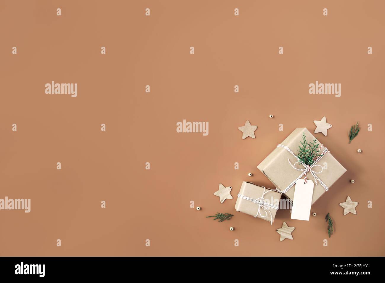 small Christmas gift boxes on beige background Stock Photo - Alamy
