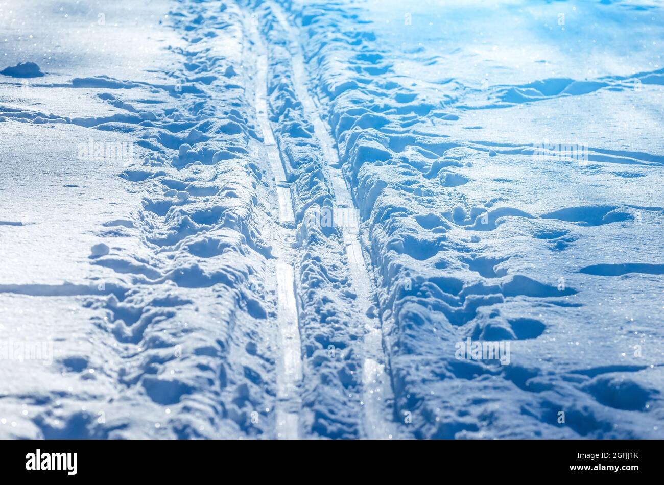 Snow lines made from a snow machine on a ski slope Stock Photo - Alamy