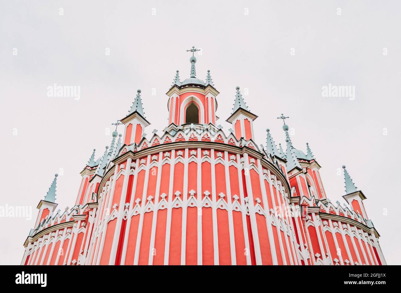 Red church with white strips in Gothic style Stock Photo - Alamy