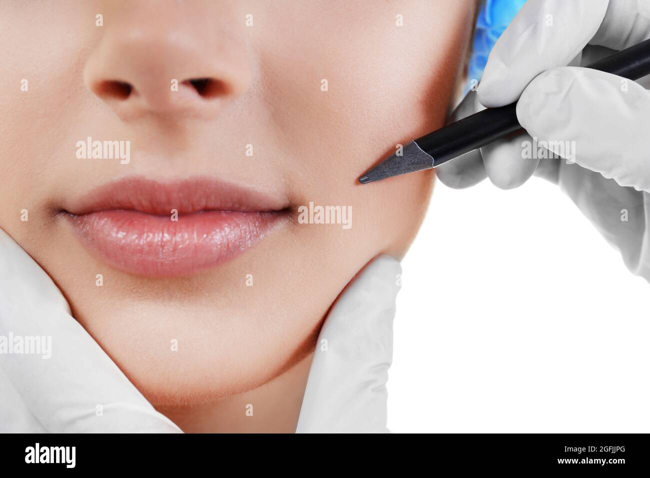 Plastic surgery concept. Hand in glove marking women face Stock Photo ...