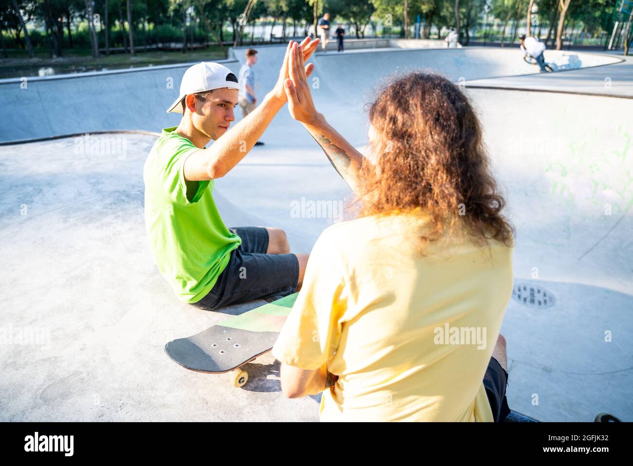 professional skateboarders having fun at the skate park Stock Photo - Alamy
