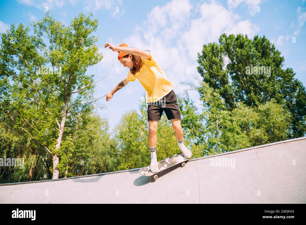 professional skateboarders having fun at the skate park Stock Photo - Alamy