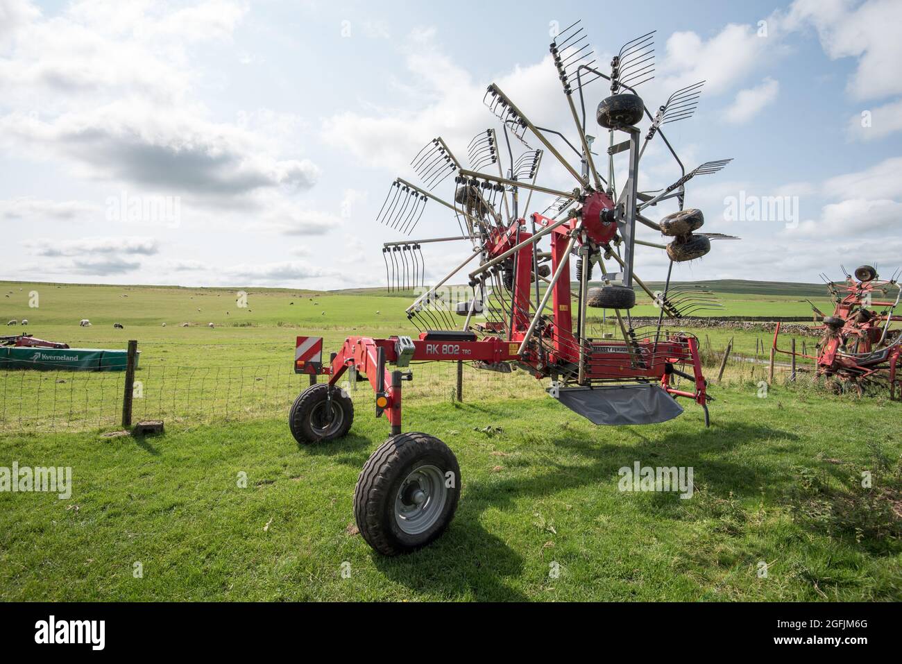 Massey Ferguson RK 802 TRC rotor rake (rotary rake) stands out against ...