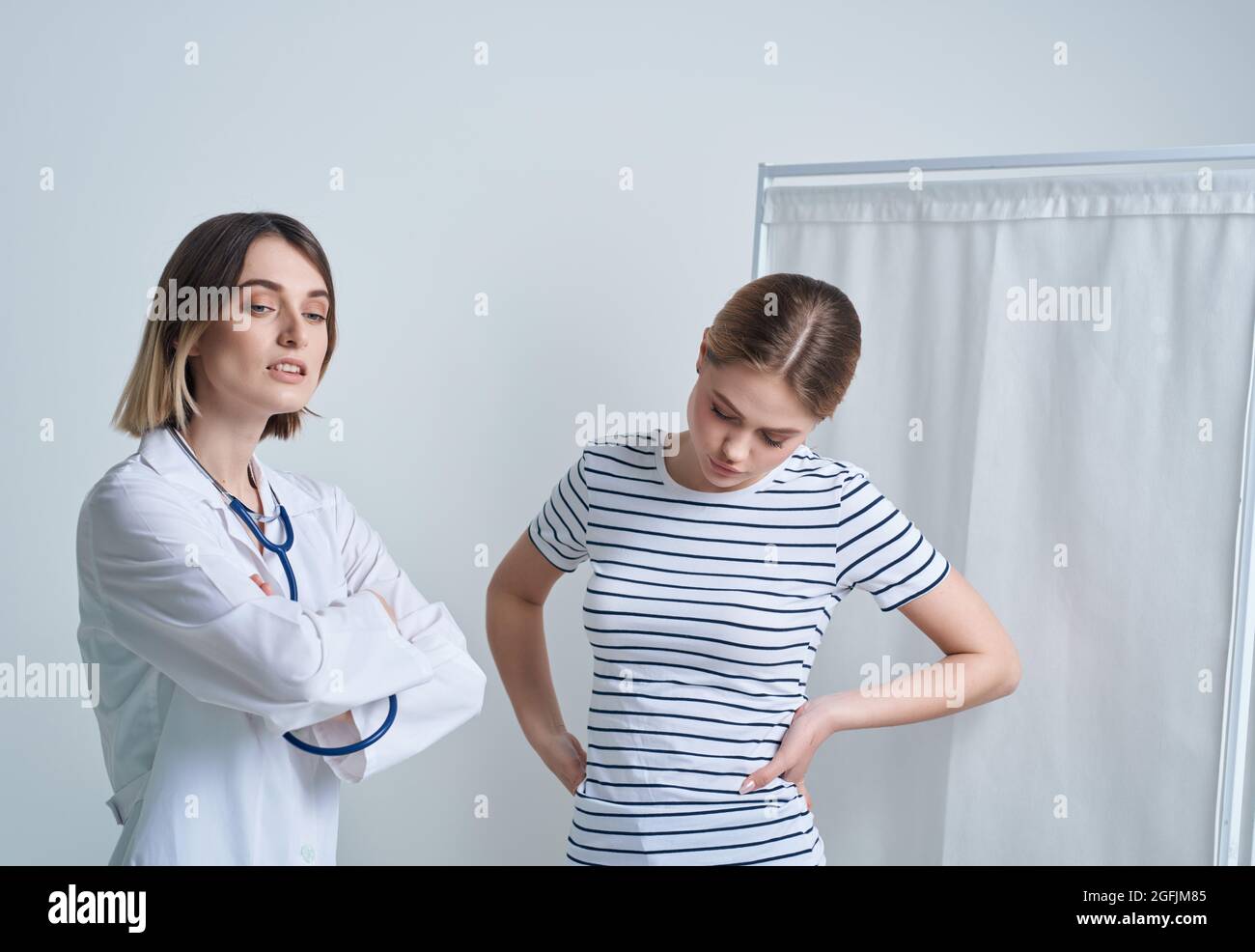 doctor next to patient diagnosis treatment hospital Stock Photo - Alamy