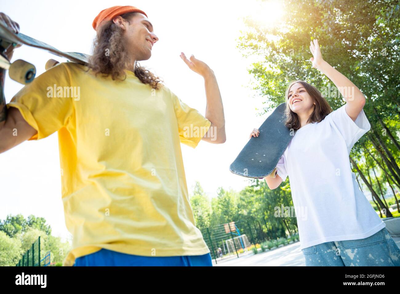 Professional skateboarders having fun at the skate park Stock Photo - Alamy