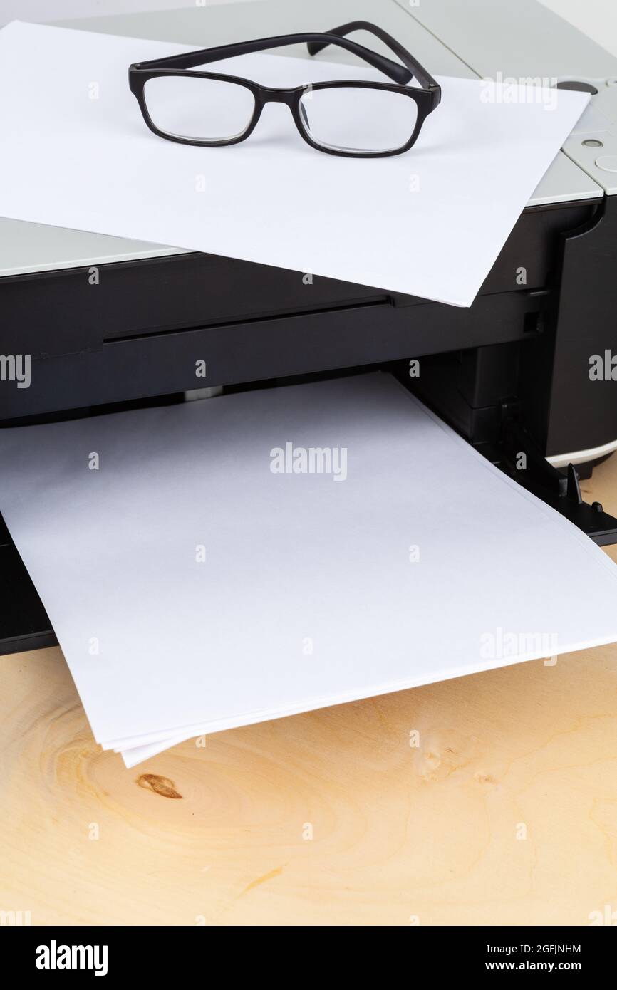 Office printer close up on a wooden table Stock Photo - Alamy