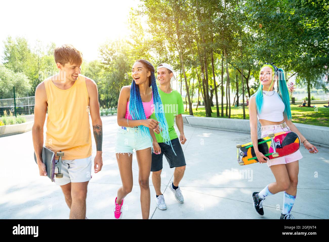Group of skaters teens at the skatepark. Professional skateboarders ...