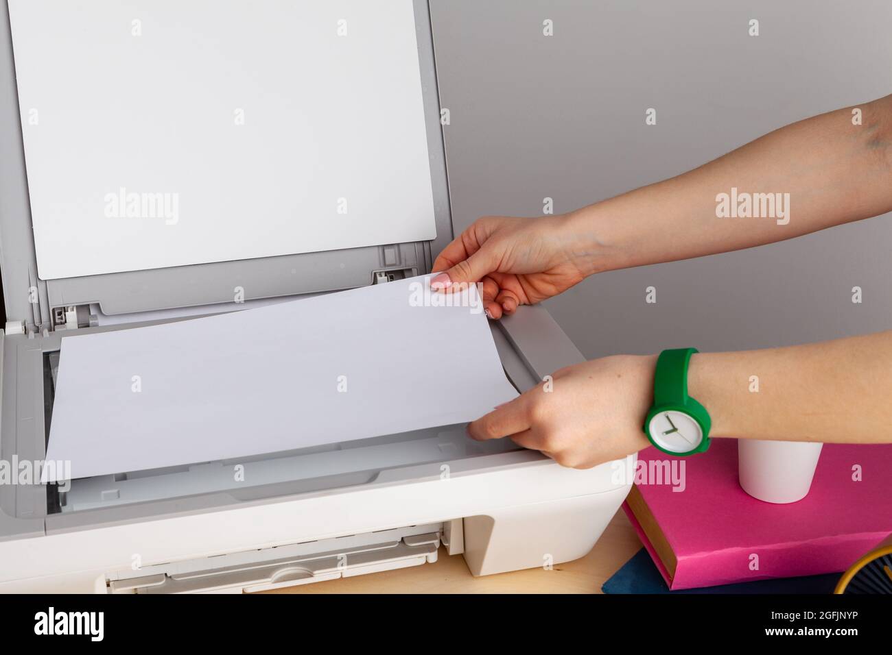 Close up of woman using a printer machine Stock Photo - Alamy