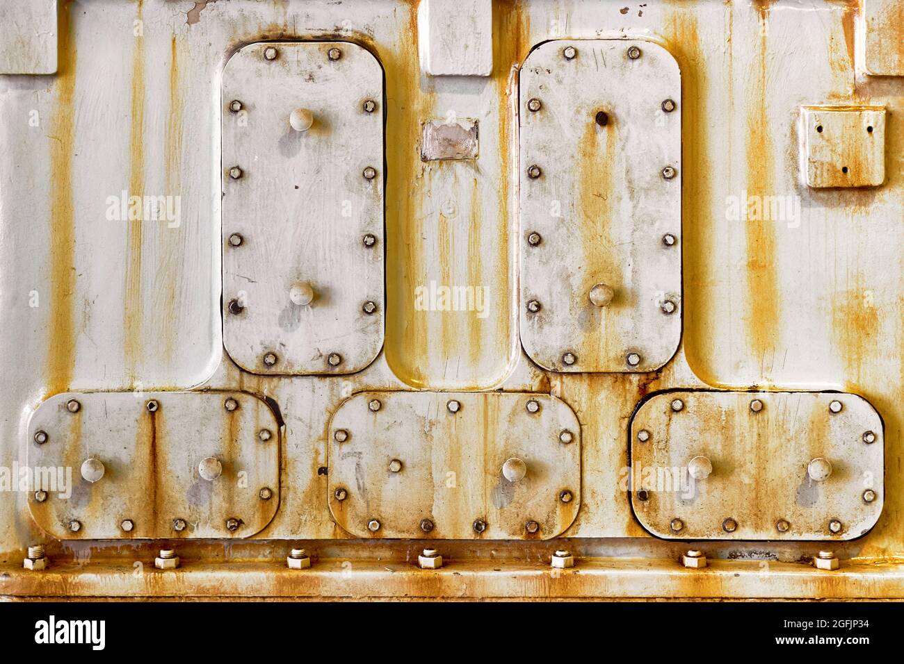 Metal hatches plate on compressor for revision closeup with oil and ...