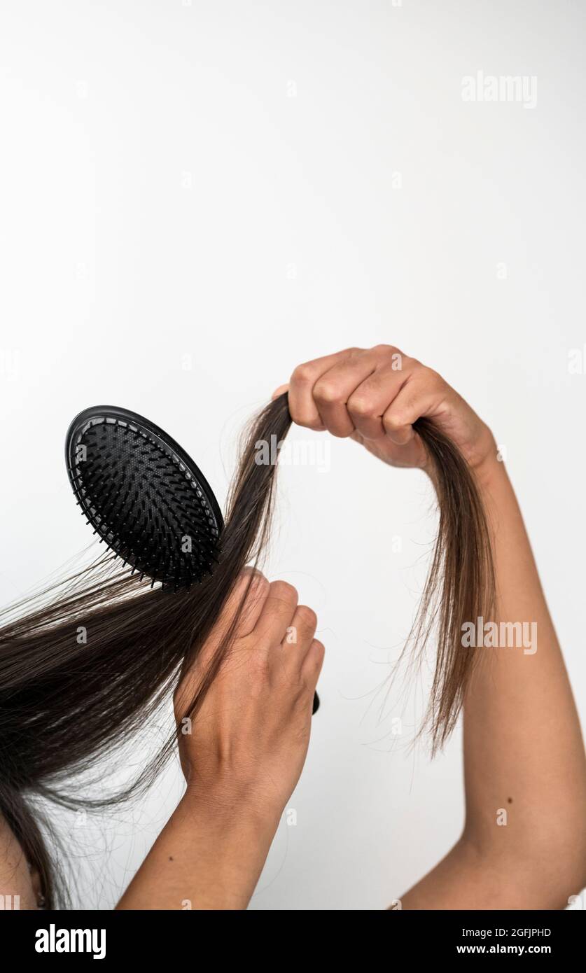 Girl combing long hair hi-res stock photography and images - Alamy