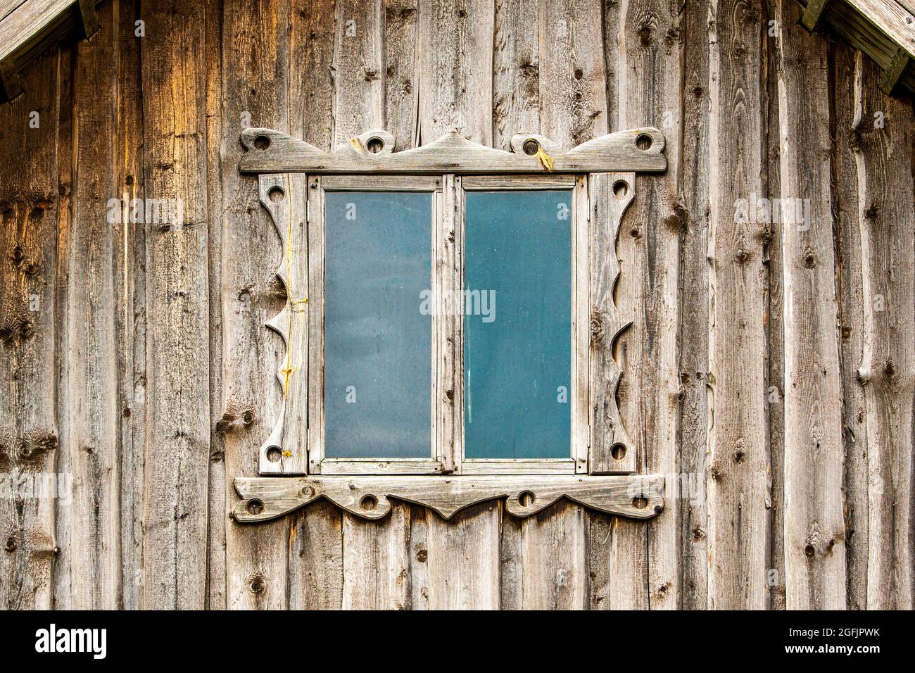 Wooden window under the roof of old log house Stock Photo - Alamy