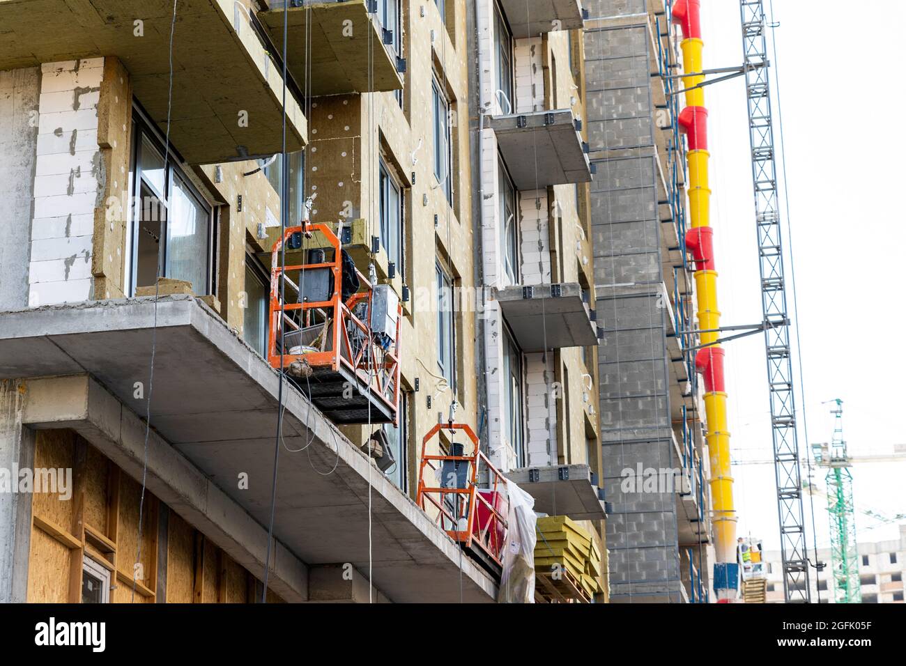 Suspended construction craddle near wall of hightower residentaial ...