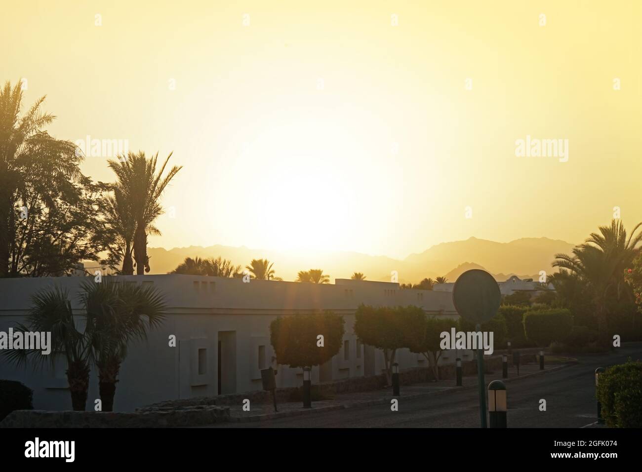 Beautiful sunrise over resort town Stock Photo - Alamy