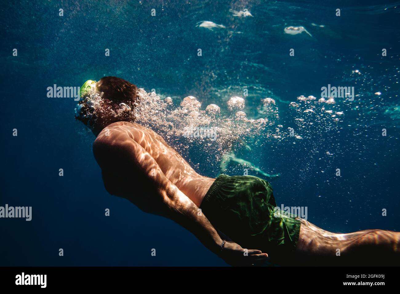 Man diving into the ocean Stock Photo - Alamy