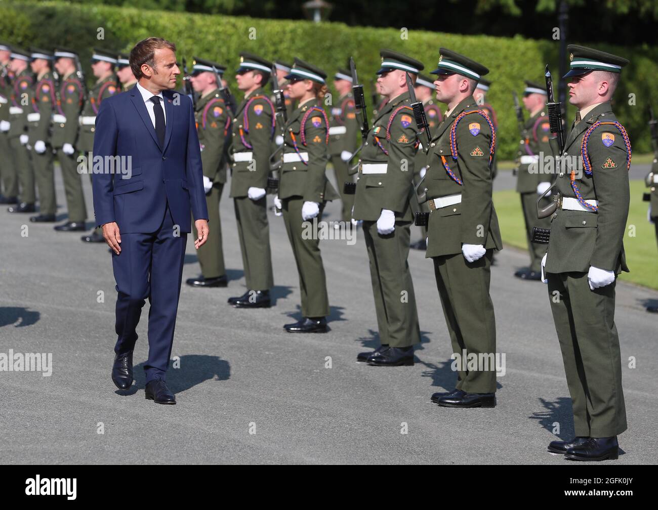 French President Emmanuel Macron inspects a Guard of Honour at Aras an ...