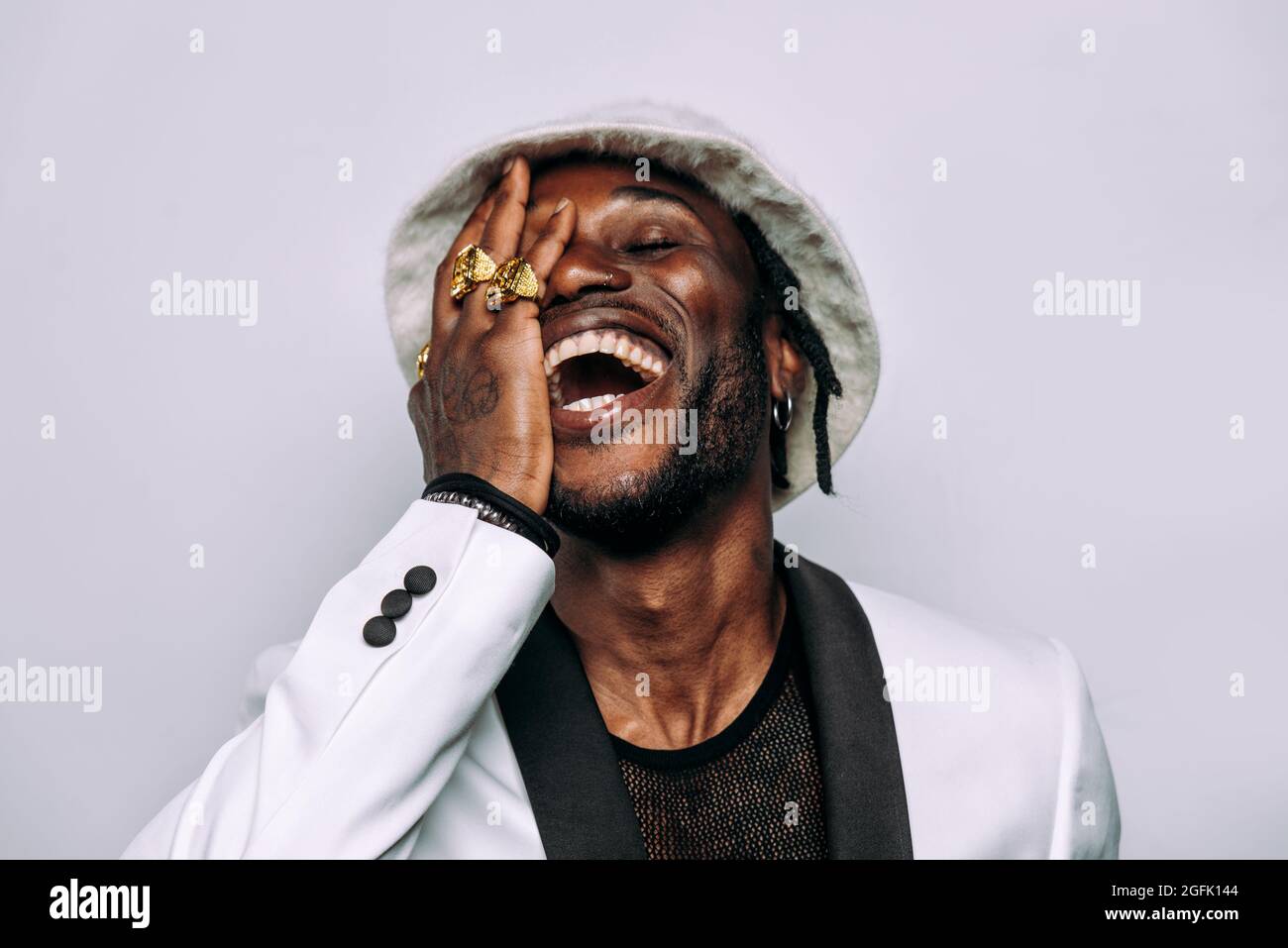 Portrait of an hip hop music musician. Cinematic image of a man wearing ...