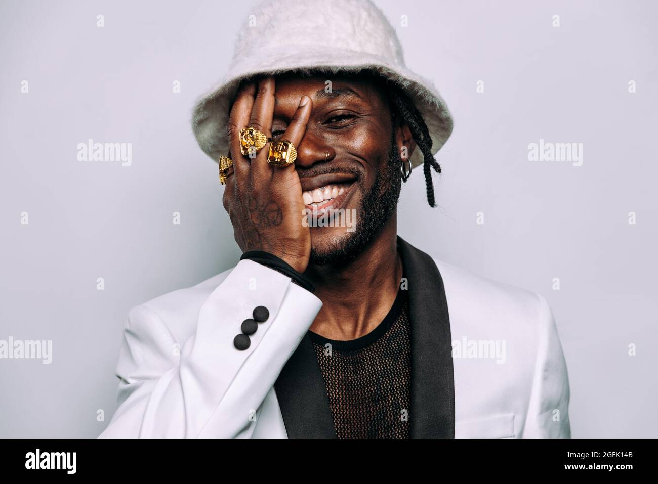 portrait of an hip hop music musician. Cinematic image of a man wearing ...