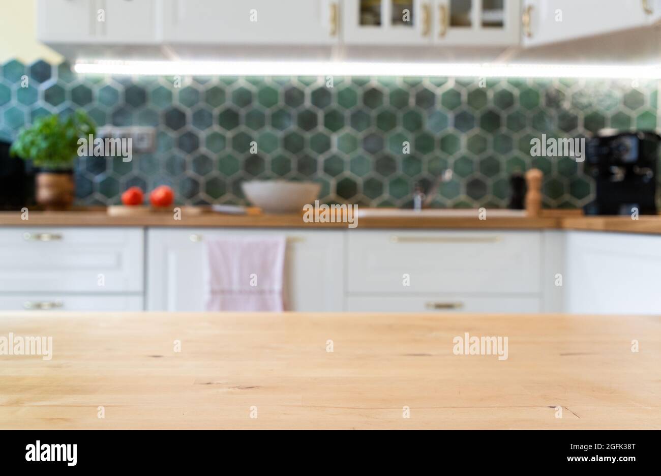 blurred kitchen interior and wooden desk space home background Stock ...