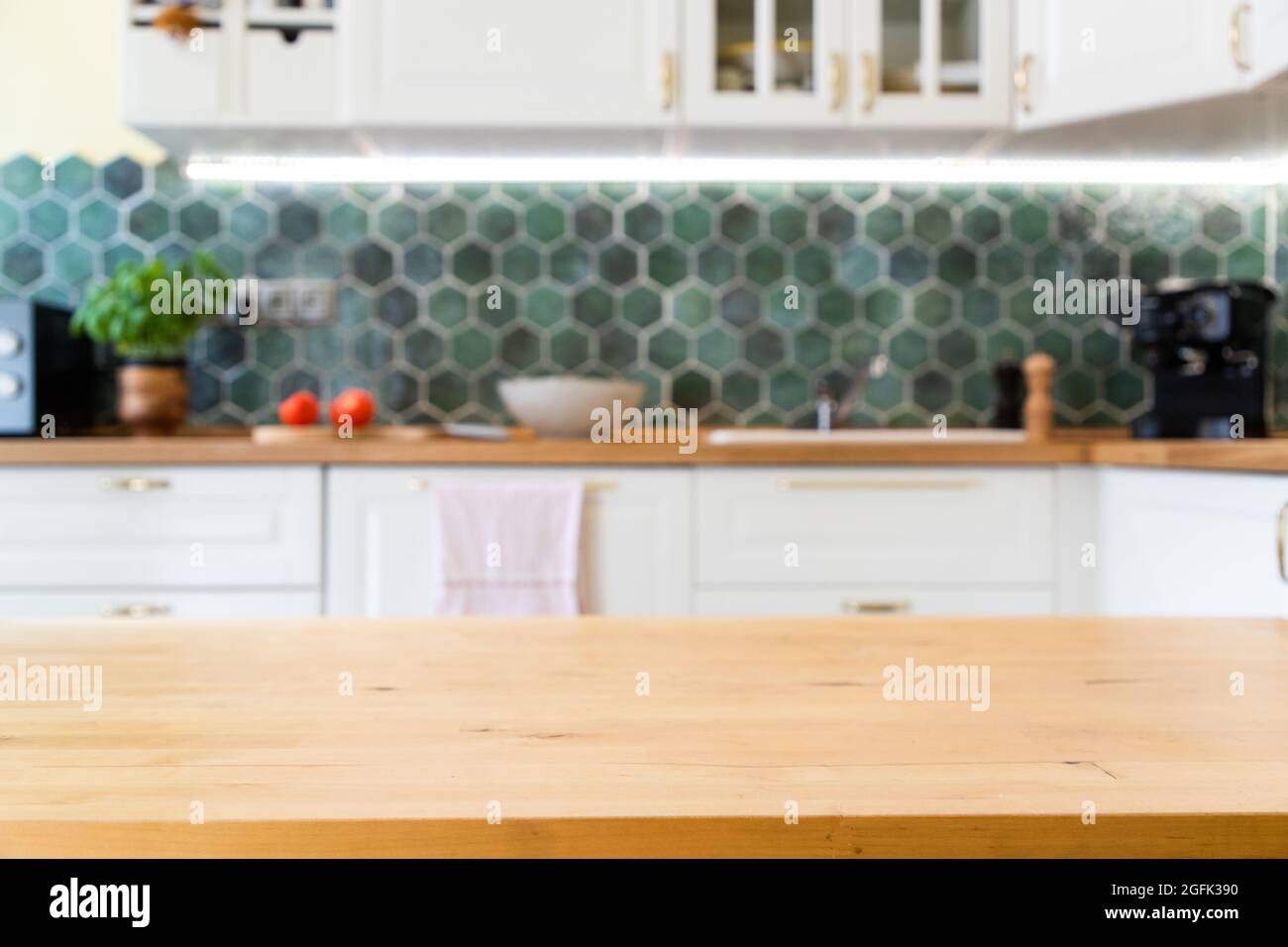 blurred kitchen interior and wooden desk space home background Stock ...