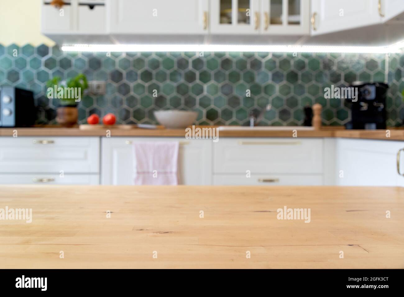blurred kitchen interior and wooden desk space home background Stock ...