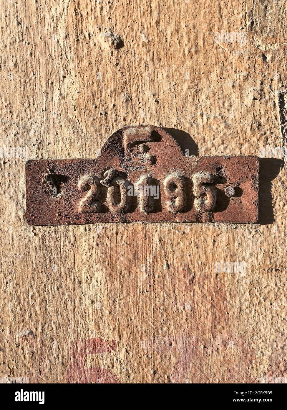 Old and rusty door number hanged on wall with copy space Stock Photo ...